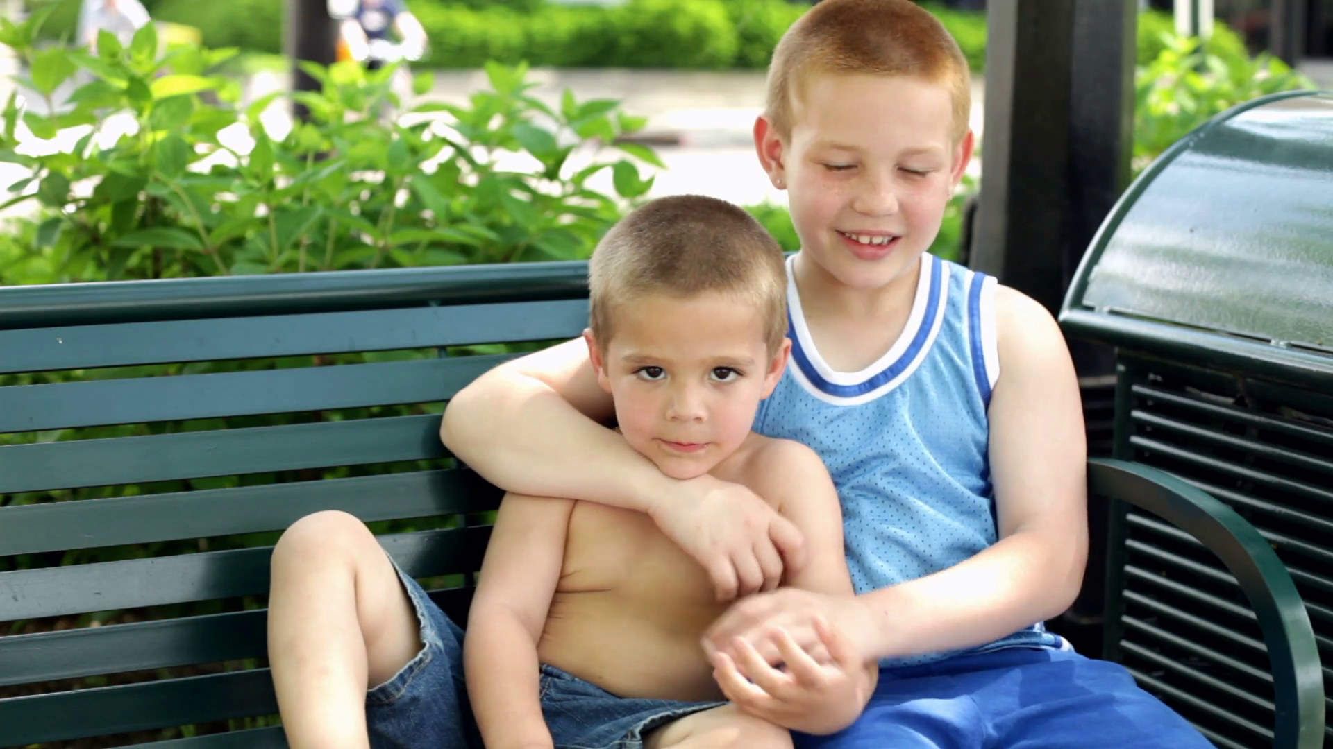 Boy Tickling Brother On Park Bench Stock Footage SBV-301093122 ...