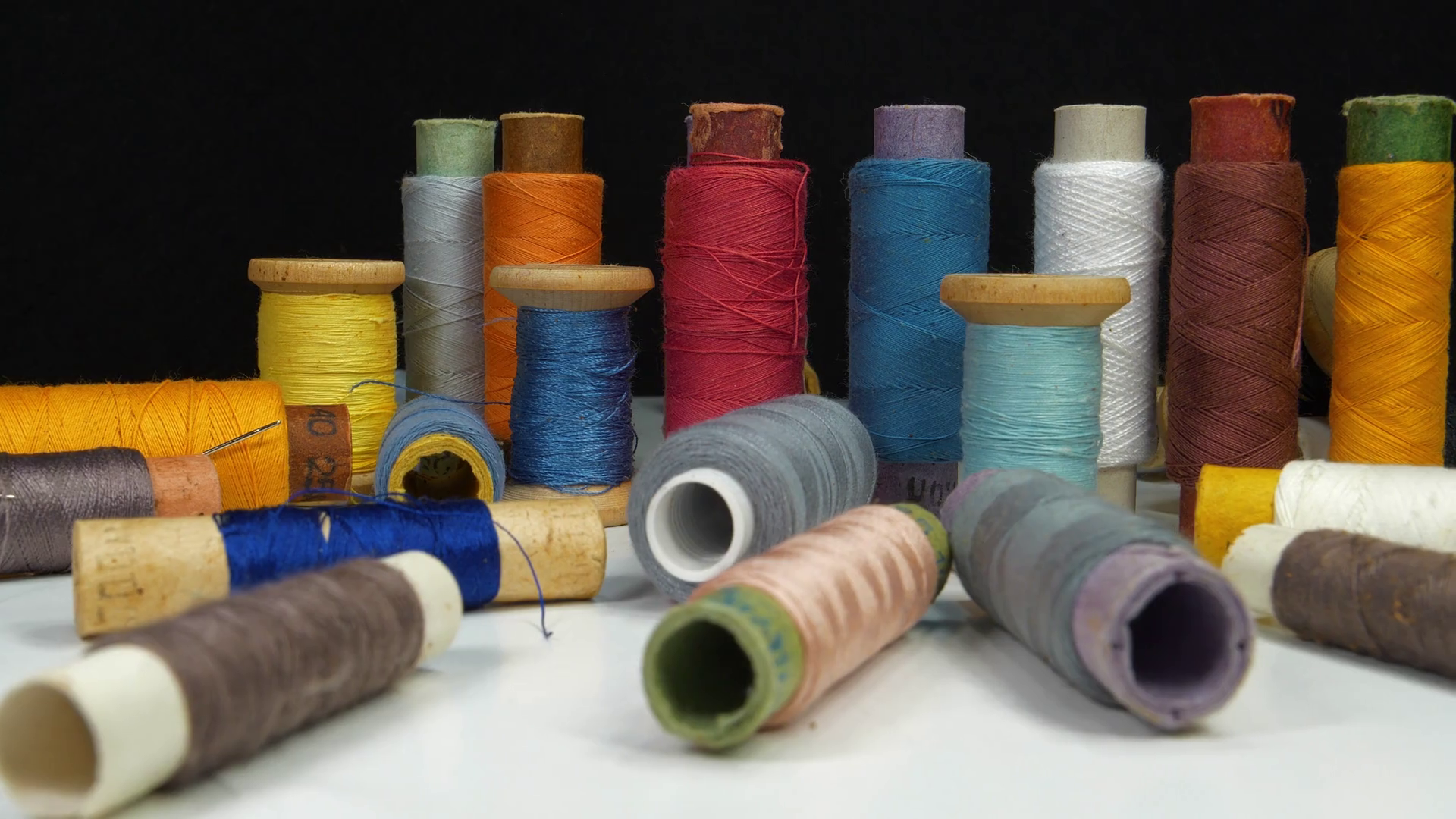 Coloured Spools Of Thread Lie On White Table Stock Footage SBV ...