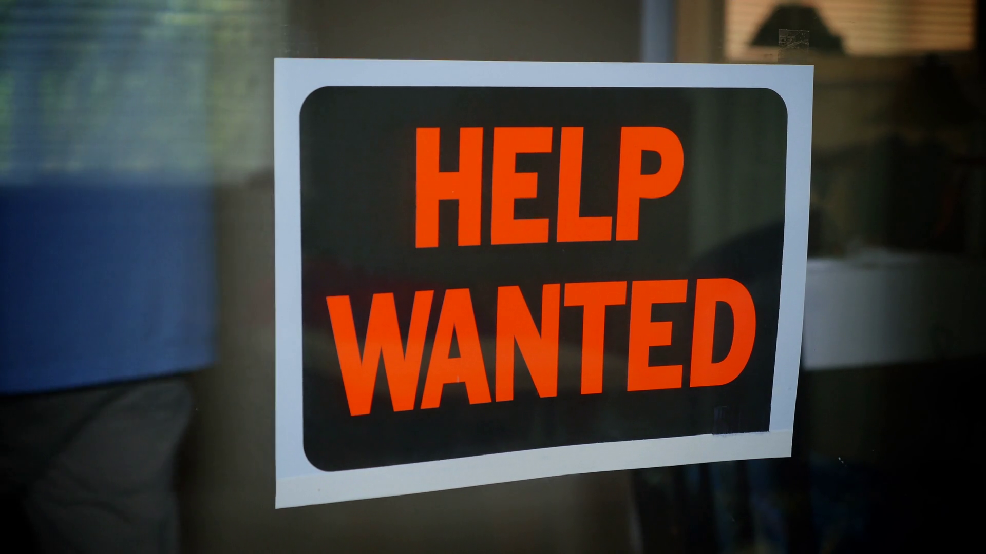 A Shop Owner Places Help Wanted Sign In Stock Footage SBV-301994813 ...