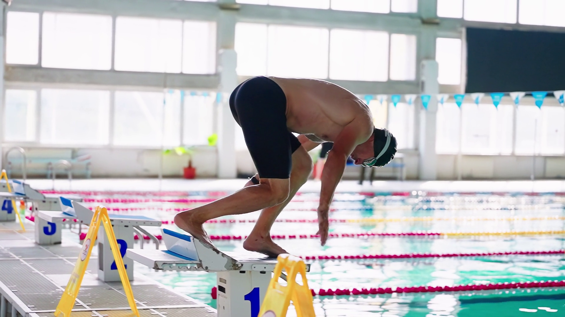 A Competitive Swimmer Prepares To Dive Into Stock Footage SBV-353410541 ...