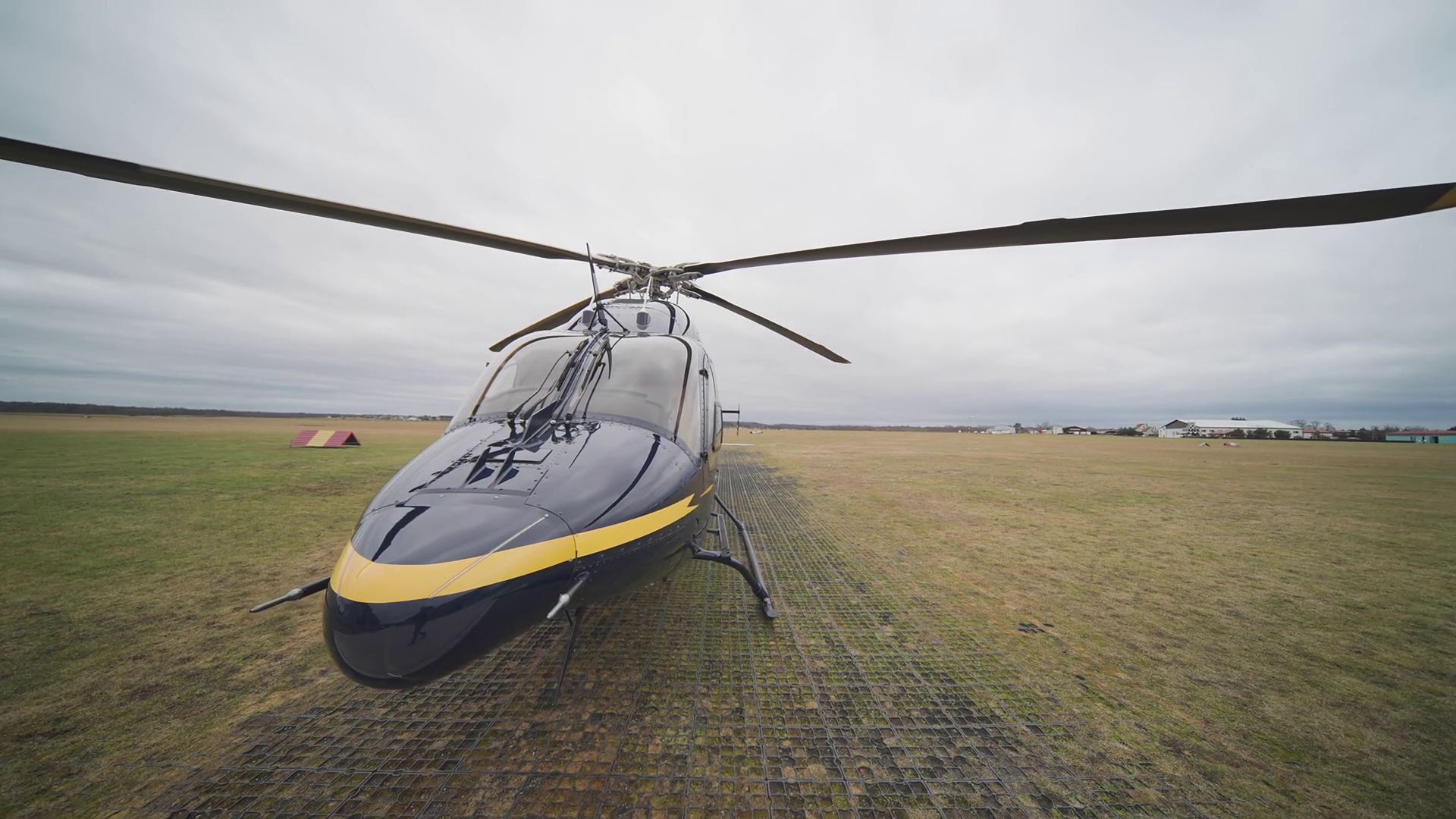 A Bell 249 Helicopter Sits Parked On Grassy Stock Footage SBV-352425550 ...