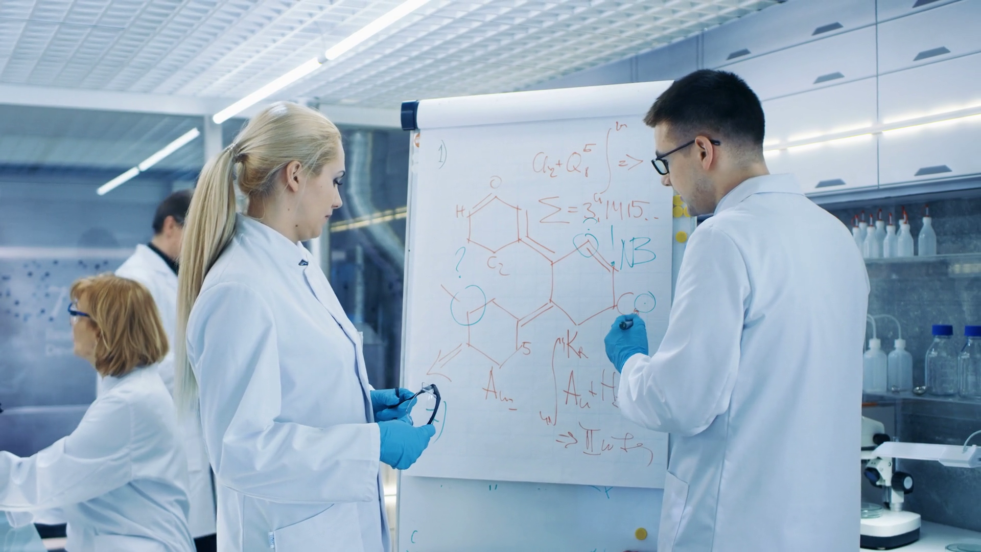 Young Female Male Scientists Write Formulas Stock Footage SBV-352253934 ...