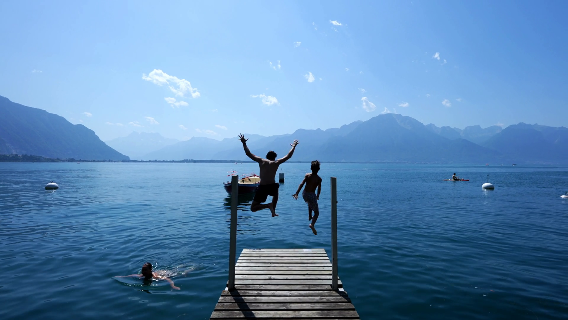 Back View Of Father Son Jumping Into Geneva Stock Footage SBV-348899383 ...