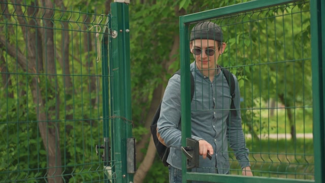 Man Opening Gate Stock Footage: Royalty-Free Video Clips - Storyblocks