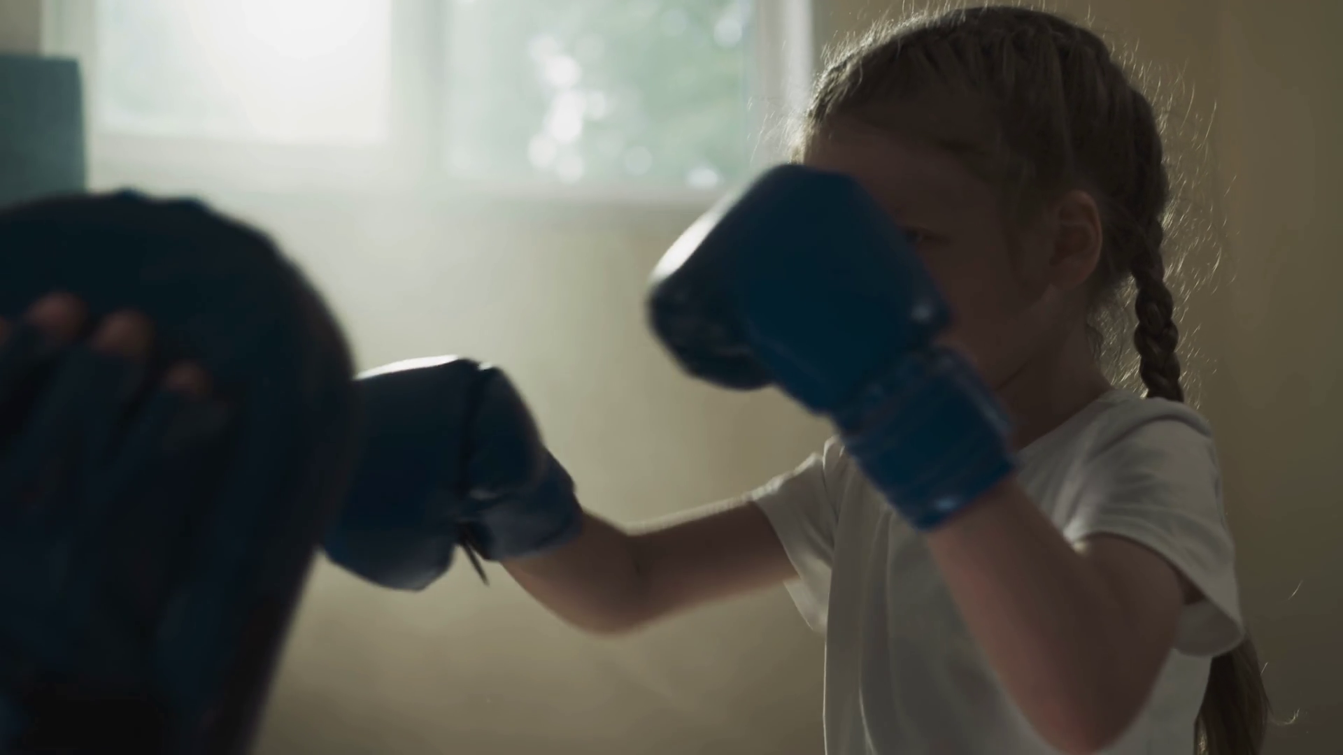Little Kid Punches Pads On Trainer Hands In Stock Footage SBV-348690715 ...