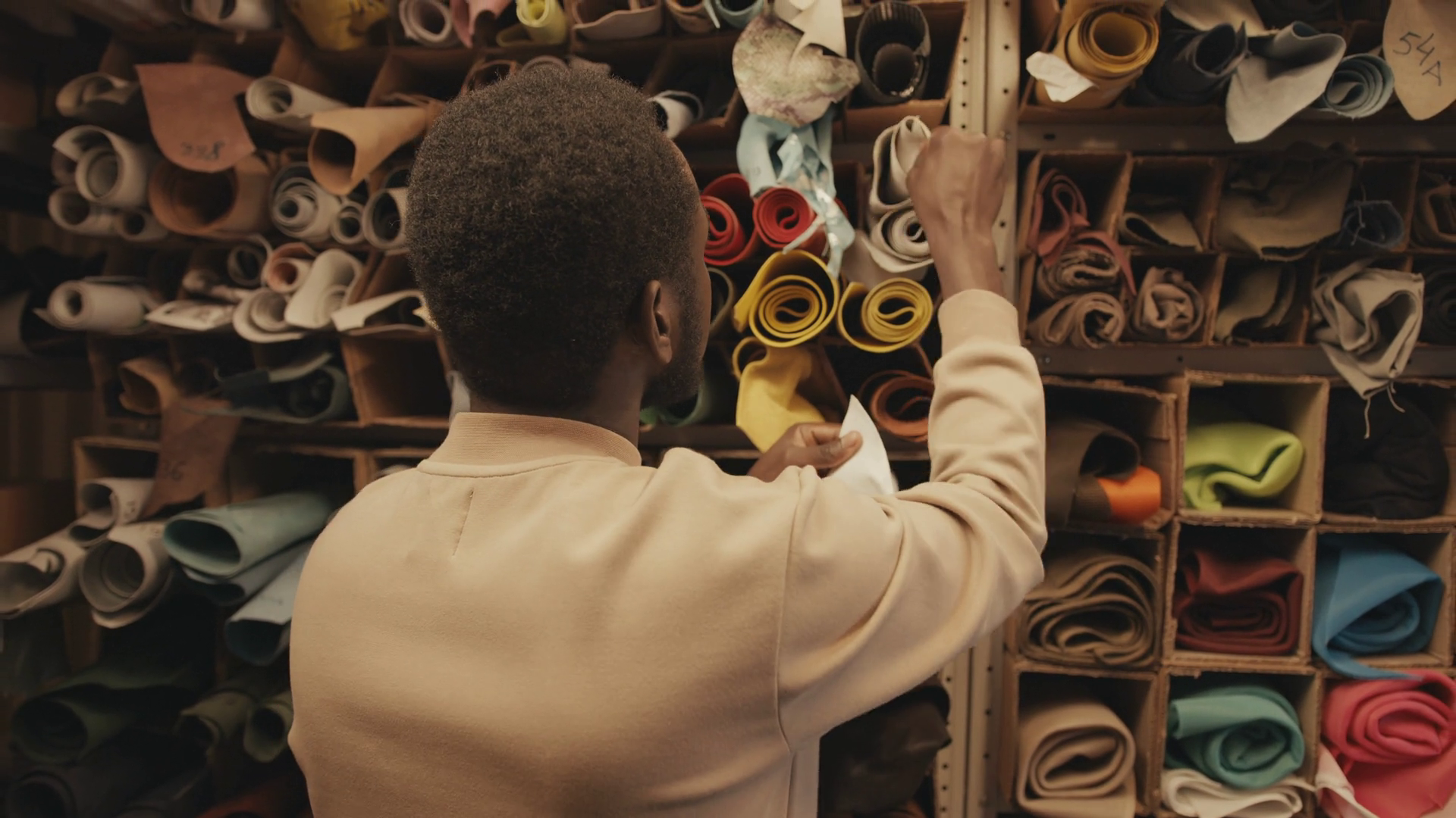 Back View Of Black Shoemaker Checking Rolls Stock Footage SBV-348801719 ...