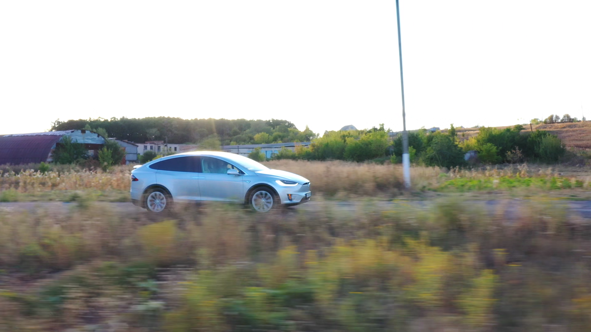 Side Aerial View Of Electrical Car Driving Stock Footage SBV-354259050 ...